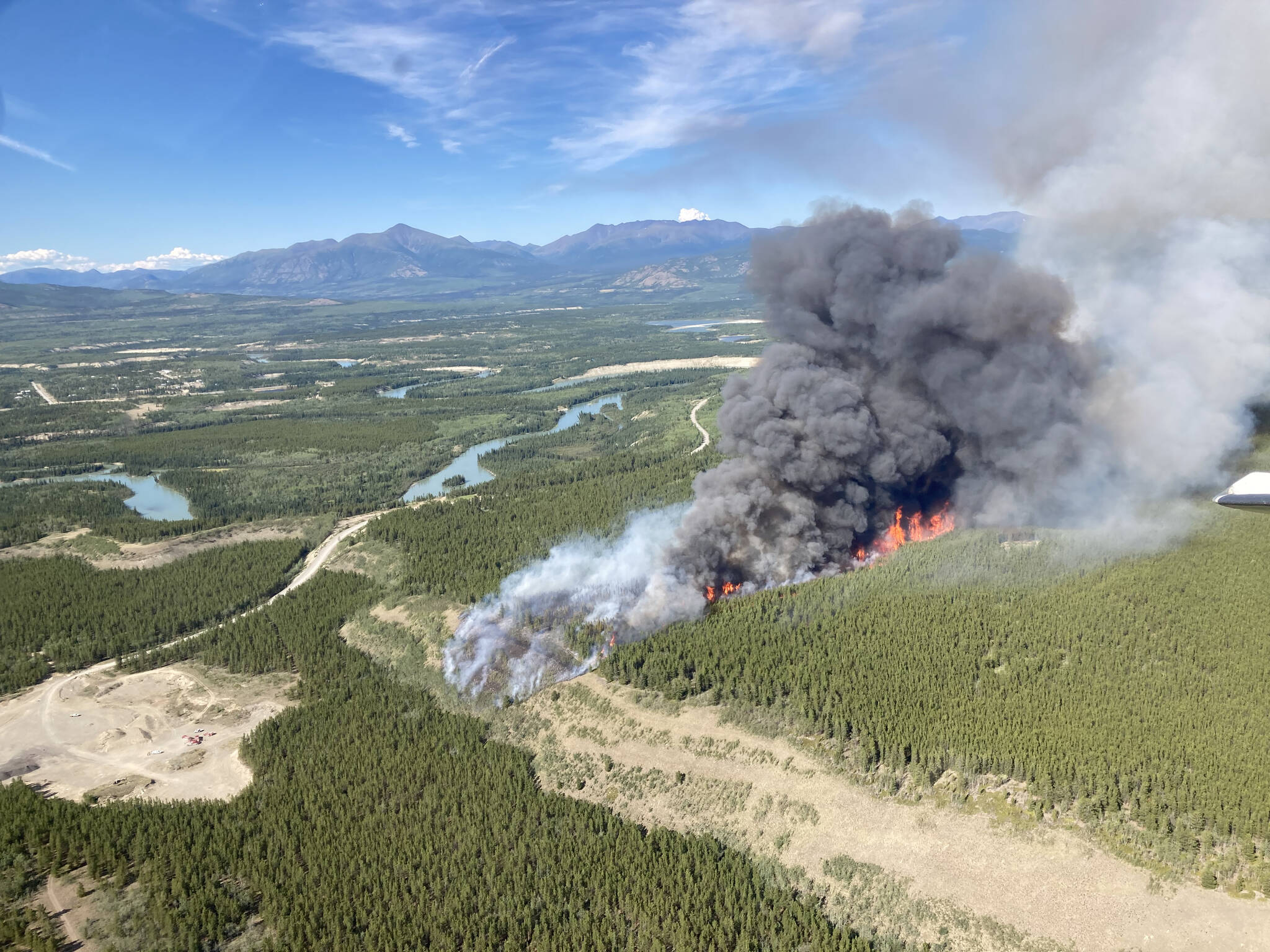 Crews work on wildfire near the Alaska Highway west of Whitehorse - Yukon News